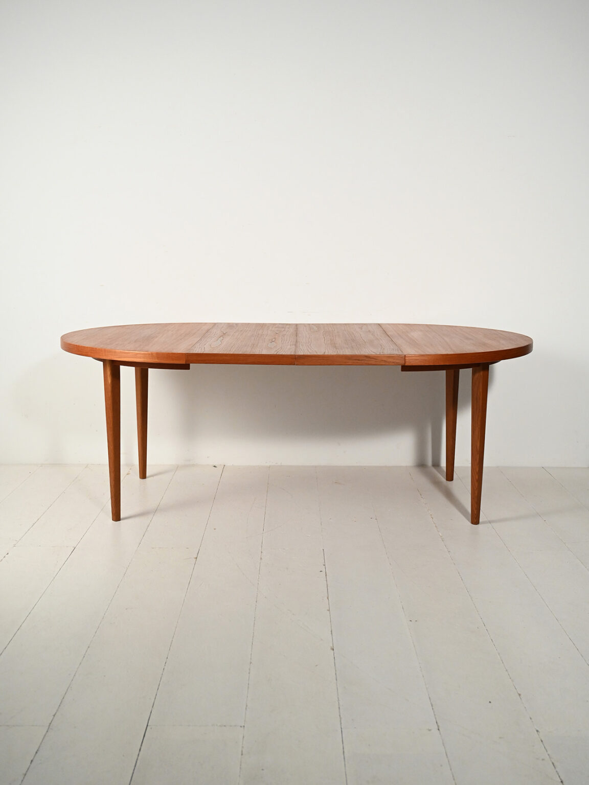 Scandinavian round extendable teak dining table | Casafika