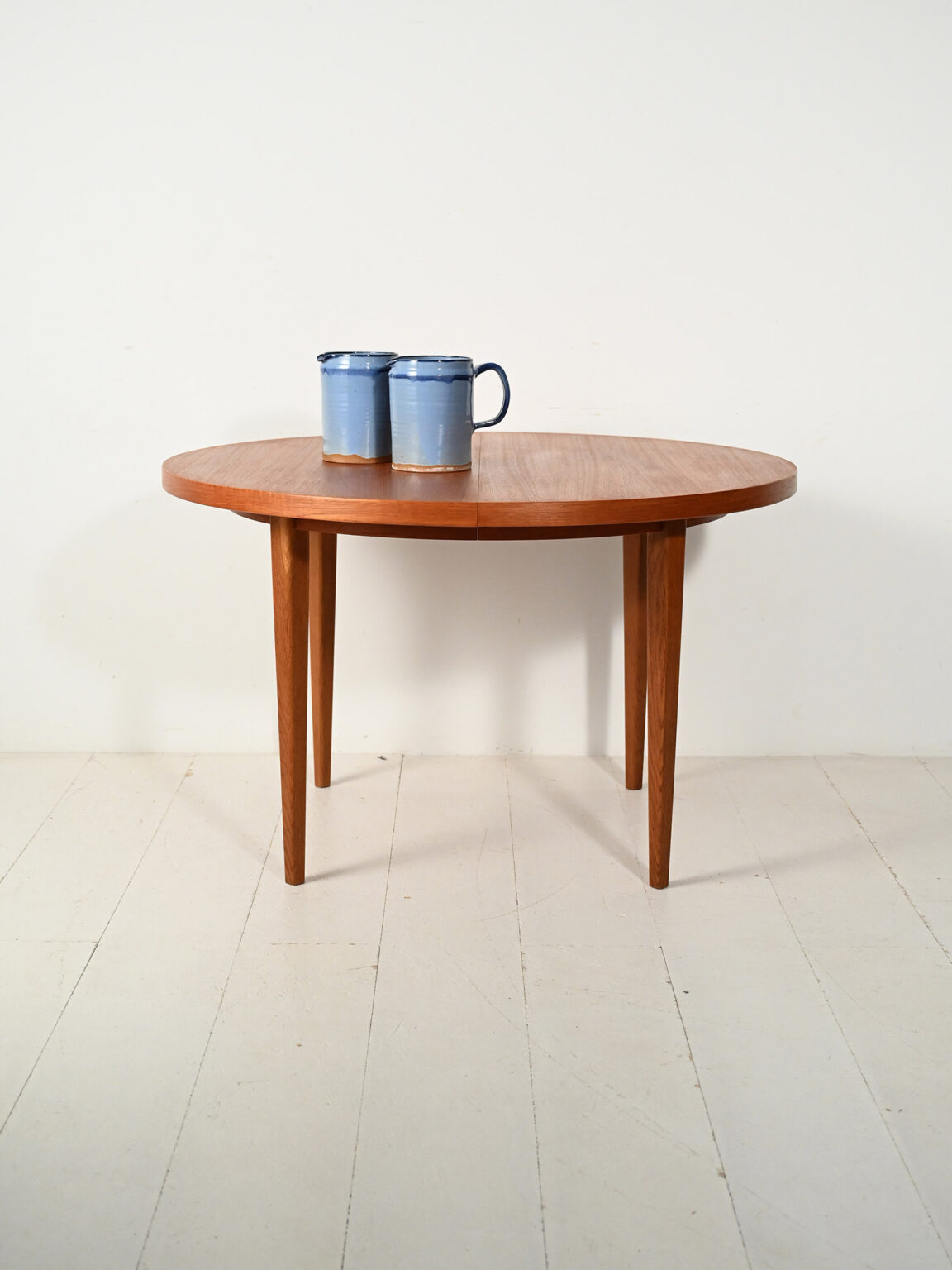 Scandinavian round extendable teak dining table | Casafika