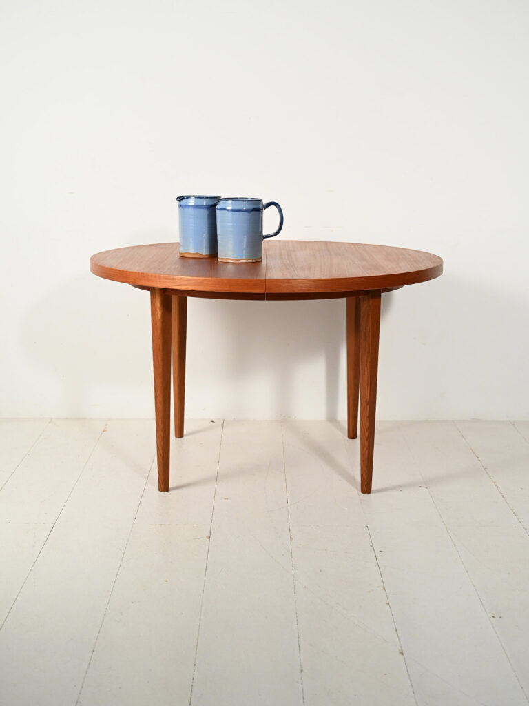 Scandinavian round extendable teak dining table | Casafika