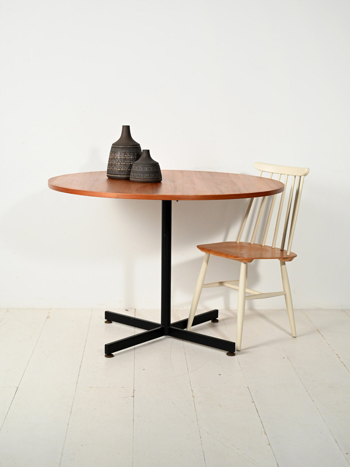 Scandinavian round teak table with metal base | Casafika
