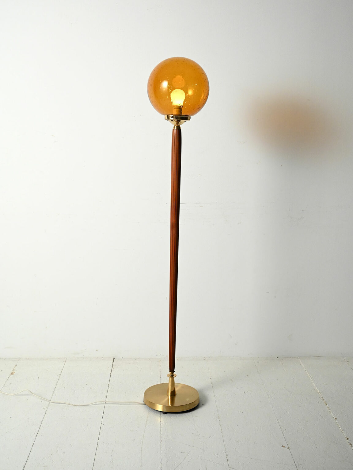 Teak and amber glass floor lamp | Casafika